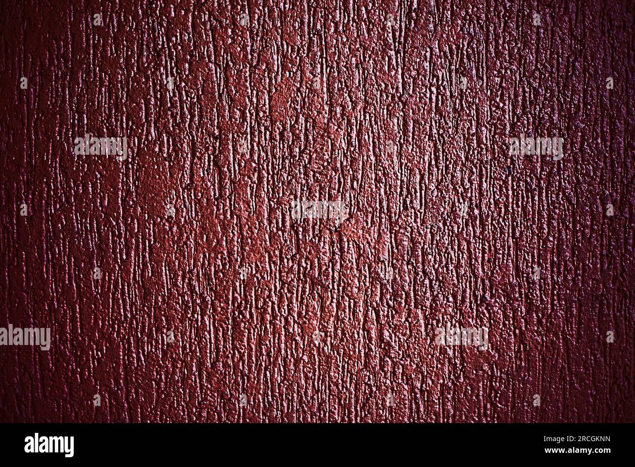 Dark burgndy red rough surface with graded light and vignette, graphic ...
