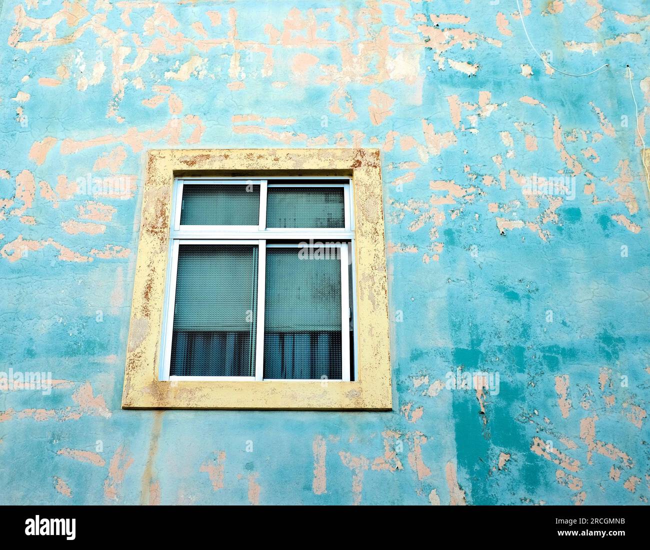 A single window in a large empty blue and pink wall Stock Photo - Alamy