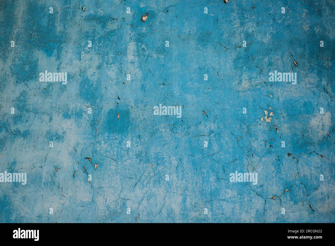 Abstract blue grungy wall with various shades of blue, light and dark ...