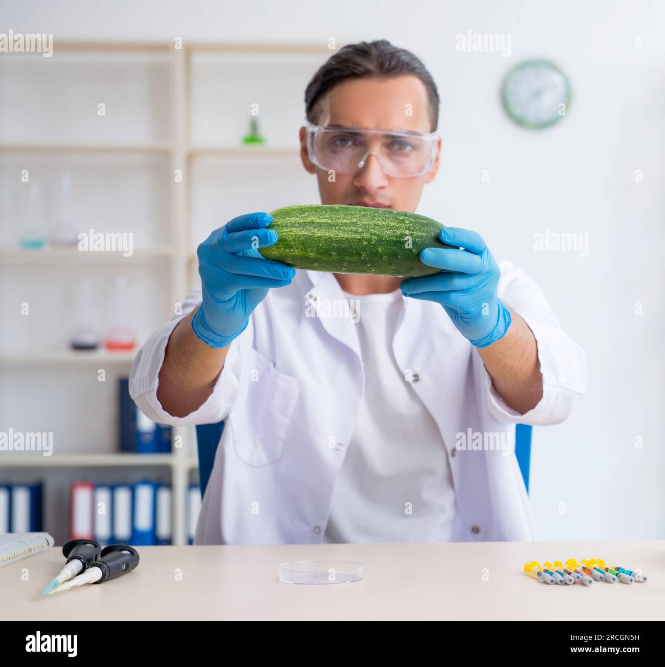 The male nutrition expert testing vegetables in lab Stock Photo - Alamy
