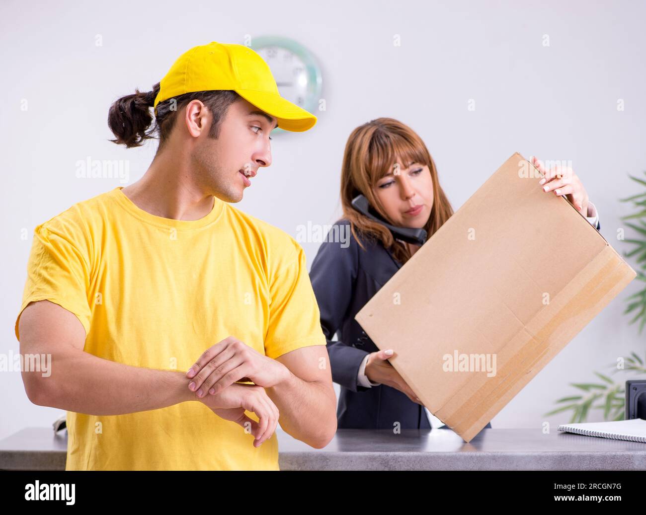 Male receptionist receiving payment hi-res stock photography and images ...