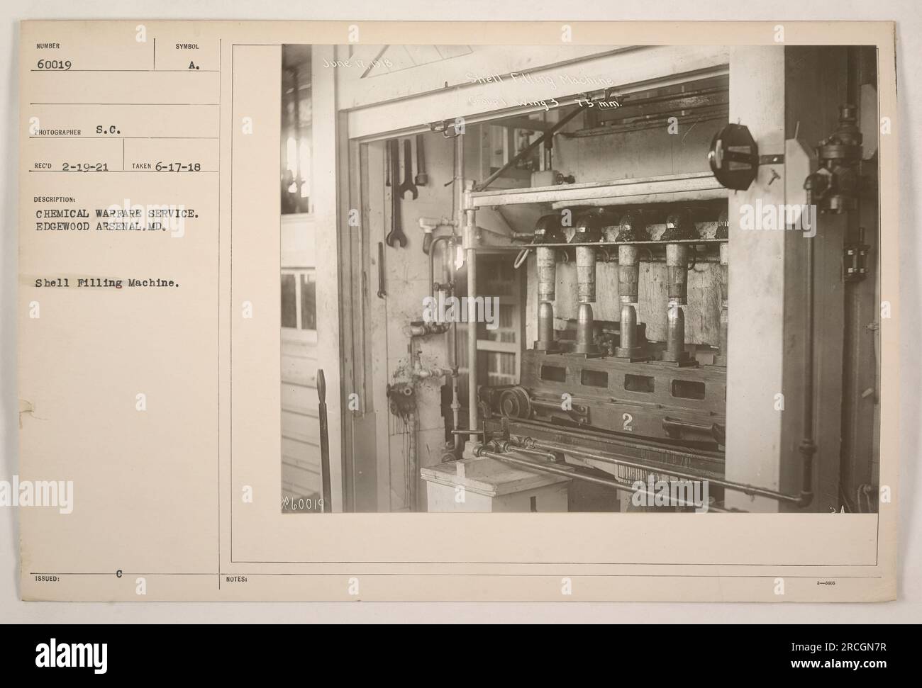 A shell filling machine at Edgewood Arsenal, Maryland, used by the ...