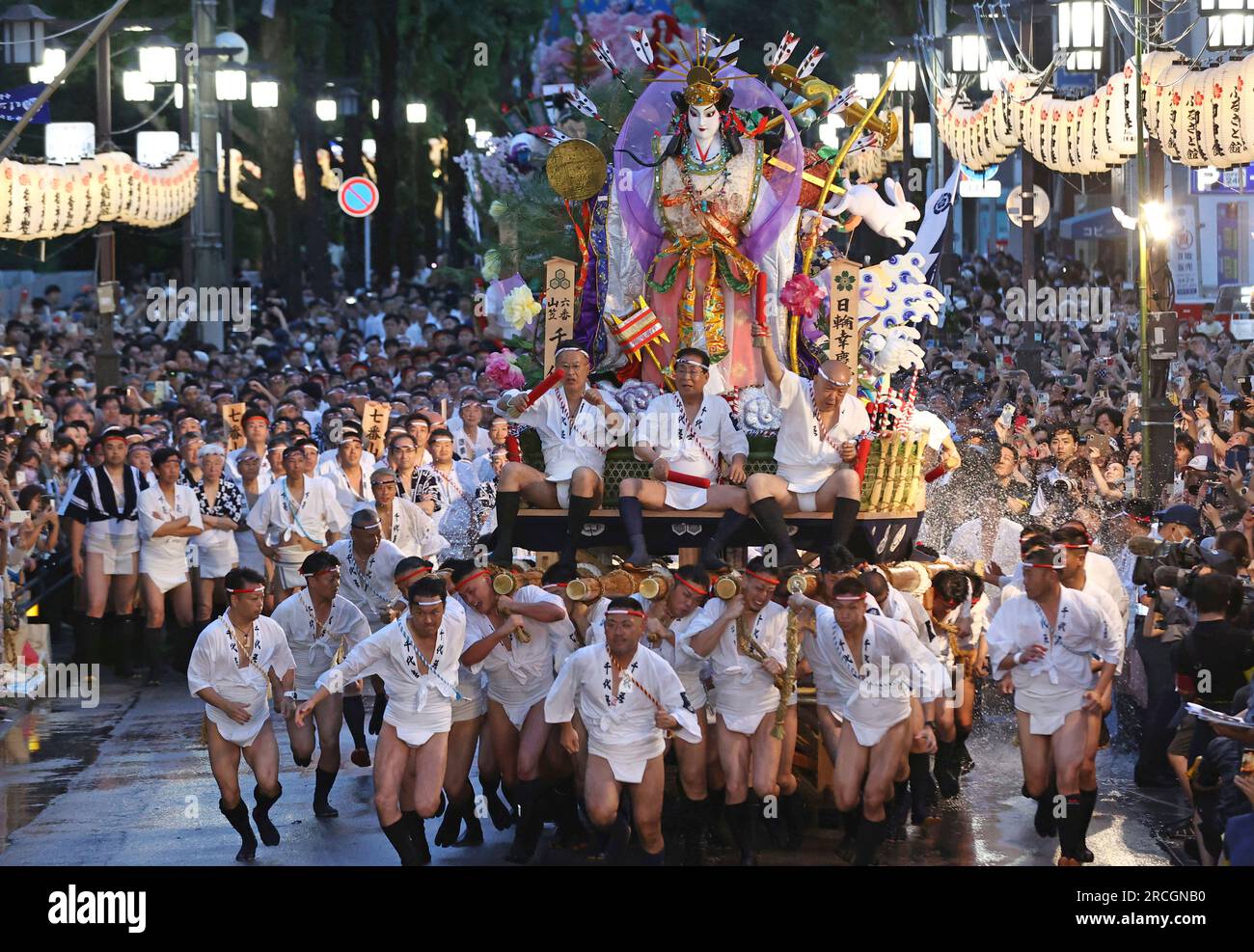 A Yamakasa float rushes for Kushida Jinja Shrine during Hakata Gion ...