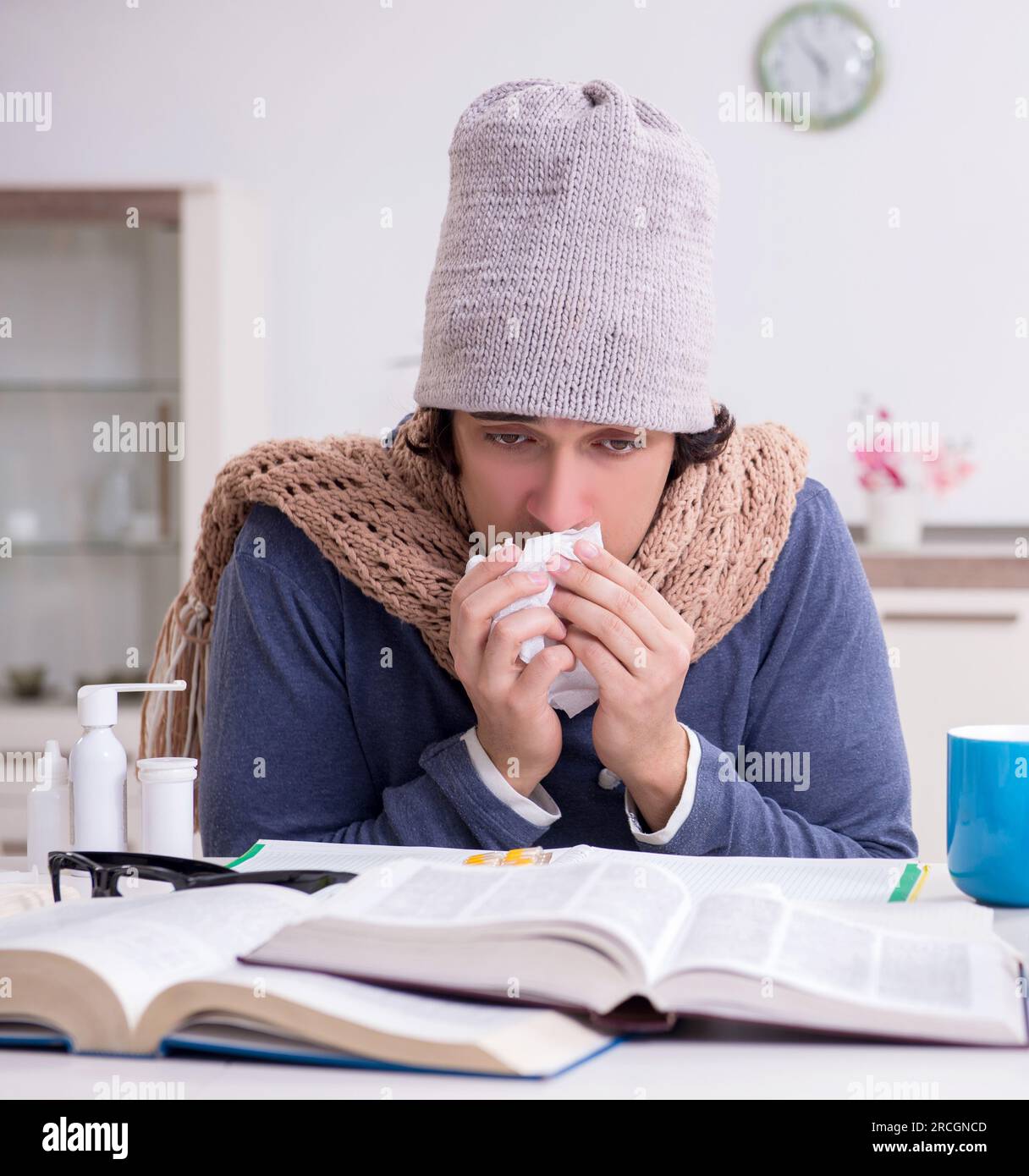 The sick male student suffering at home Stock Photo - Alamy