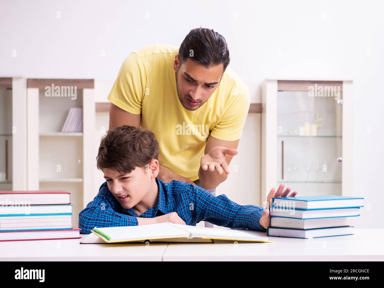 The father helping his son to prepare for school Stock Photo - Alamy