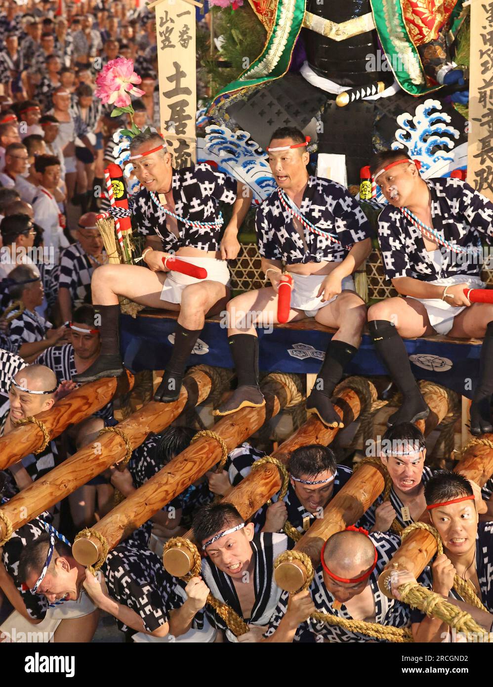 A Yamakasa float rushes for Kushida Jinja Shrine during Hakata Gion ...