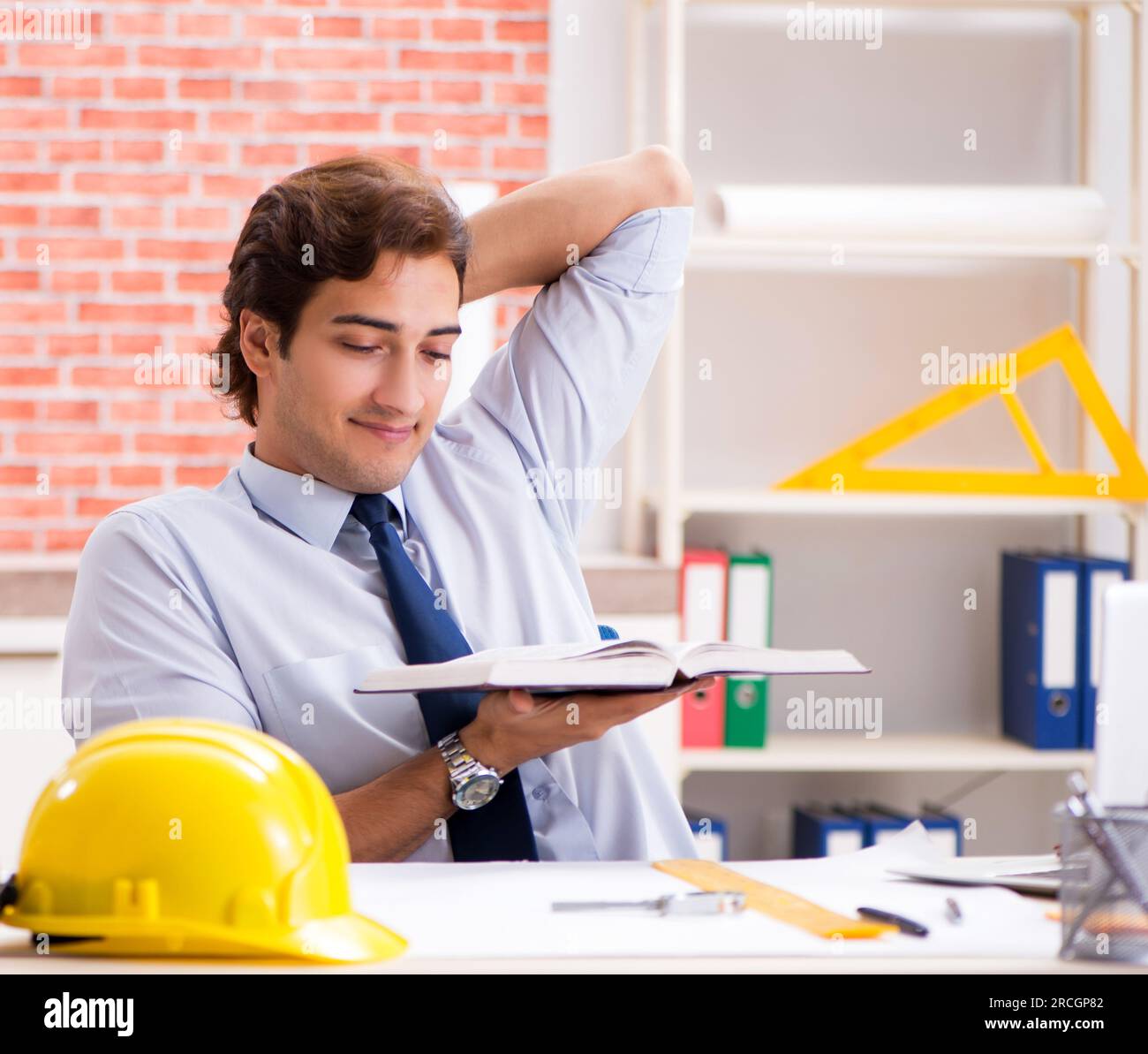 The construction supervisor working on blueprints Stock Photo - Alamy