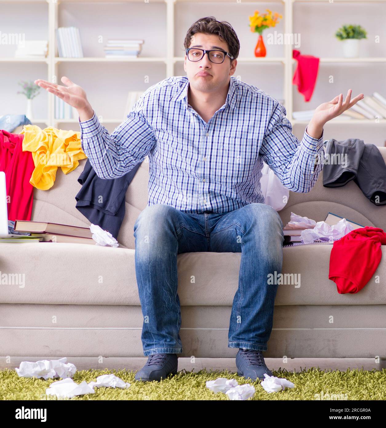 The young man working studying in messy room Stock Photo - Alamy