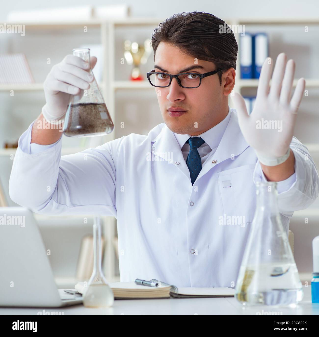 Young researcher scientist doing a water test contamination experiment ...
