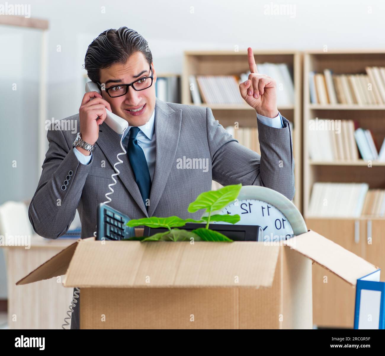 The man moving office with box and his belongings Stock Photo - Alamy