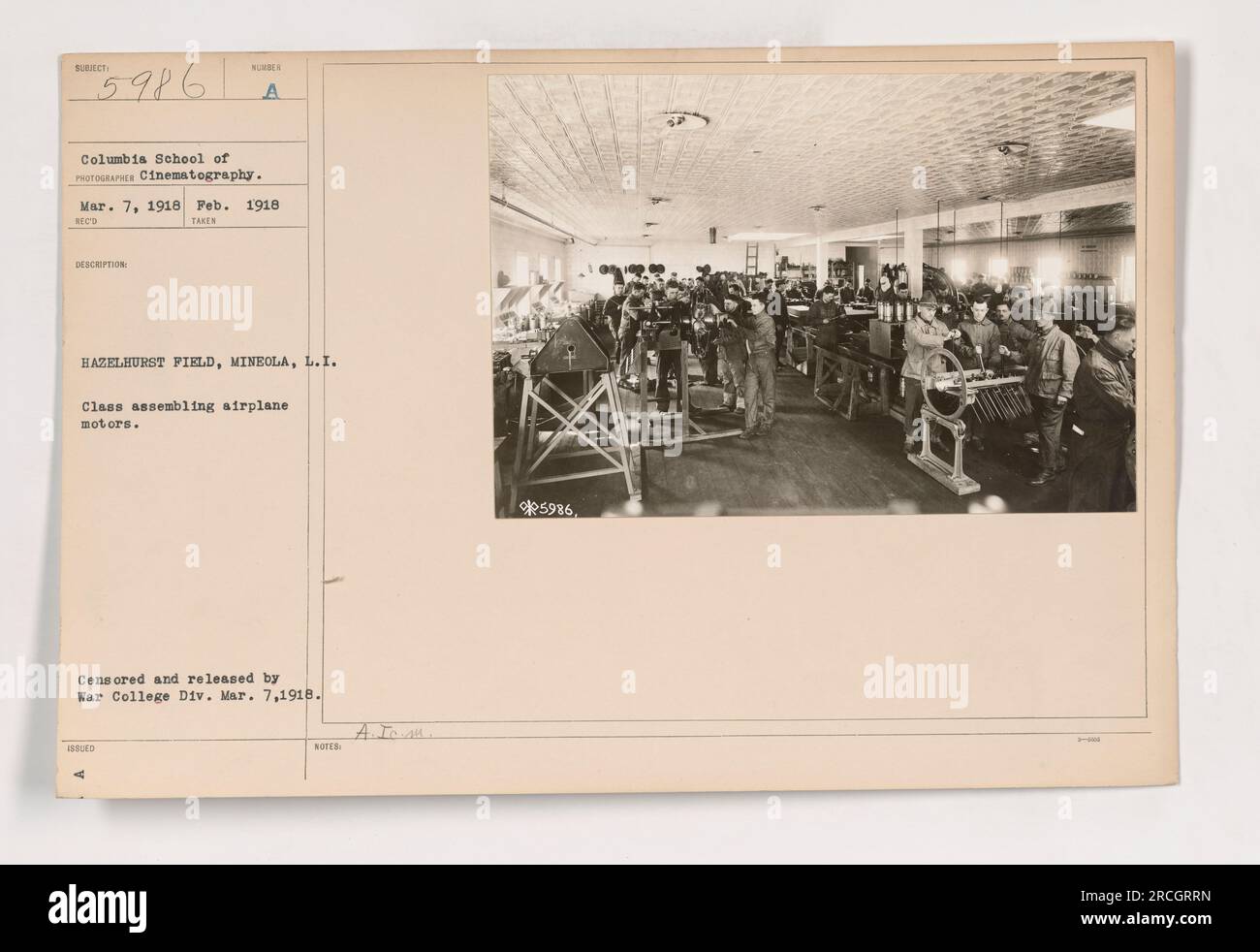 Class of soldiers participating in the assembly of airplane motors at ...