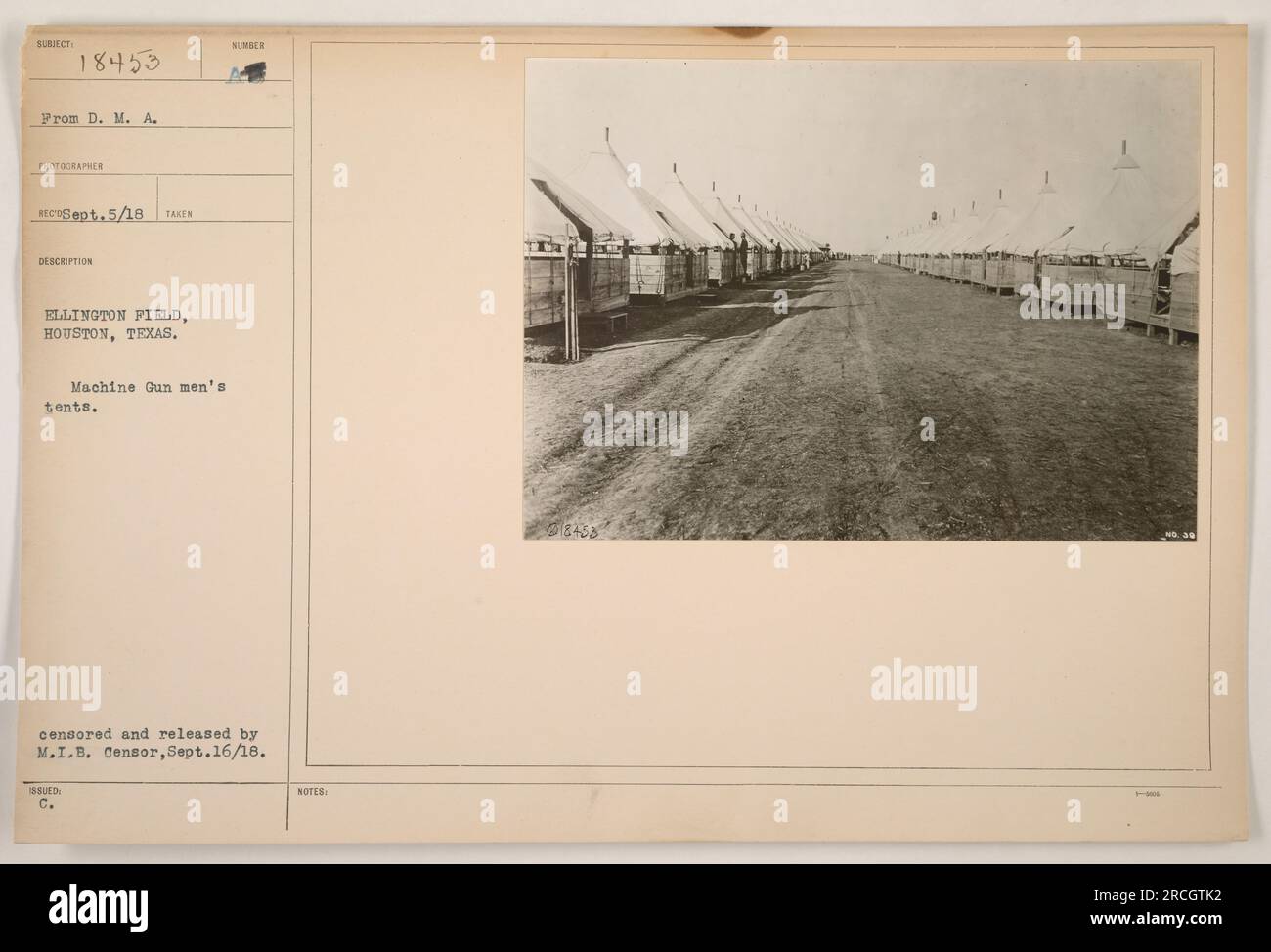 Soldiers taking care of their weapons and equipment in the machine gun men's tents at Ellington ...