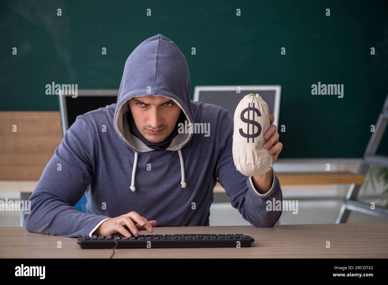 Hacker sitting computer cracking hi-res stock photography and images ...
