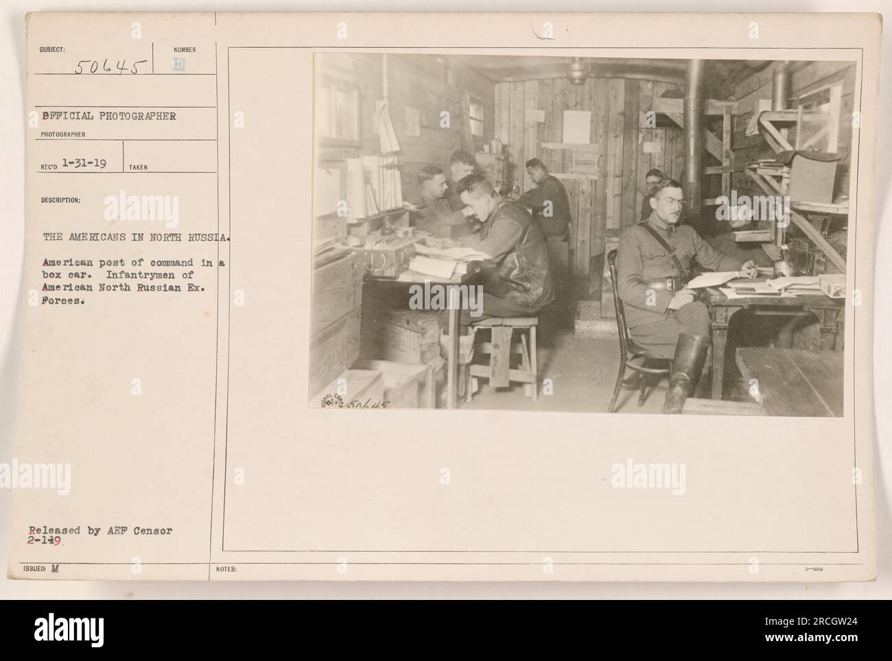 American military personnel set up a post of command inside a box car ...