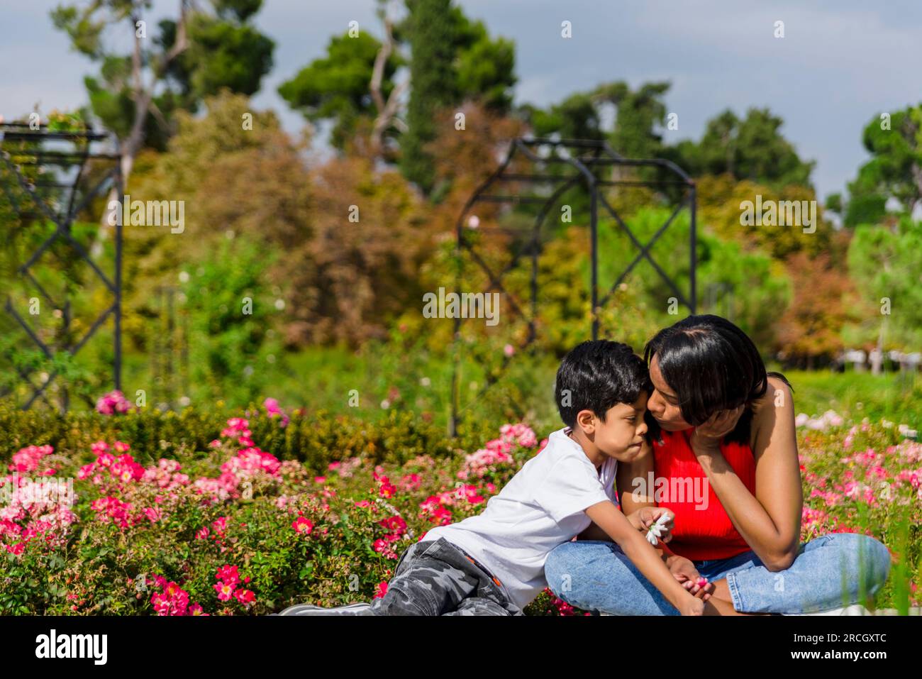 Mother and son having fun together while enjoying a day in the park ...