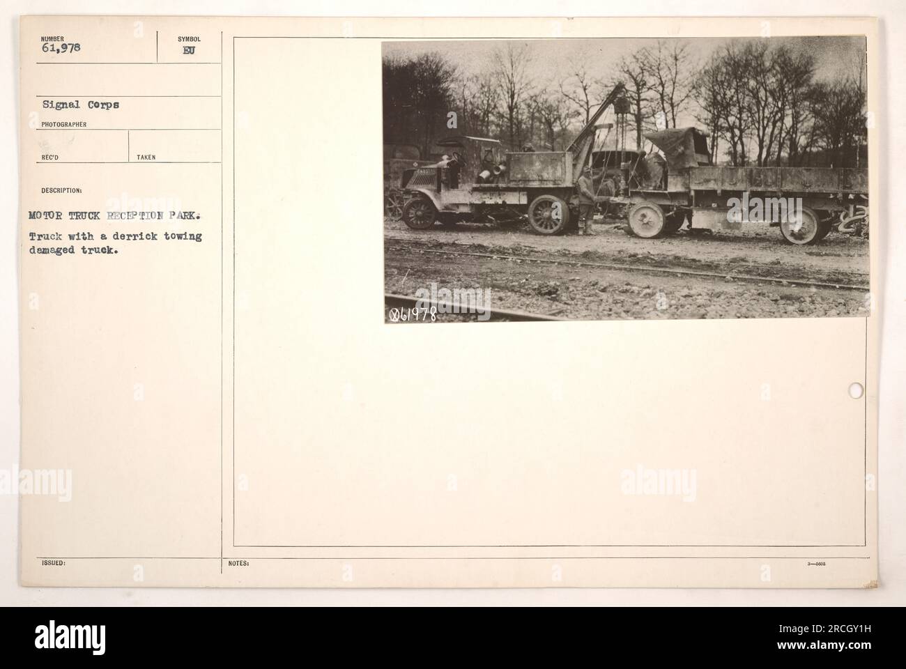 A truck with a derrick at the Motor Truck Reception Park is seen towing ...