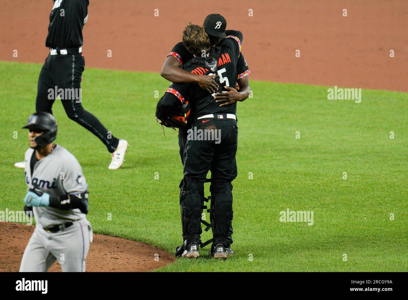 Baltimore Orioles catcher Adley Rutschman (35) and relief pitcher Felix ...