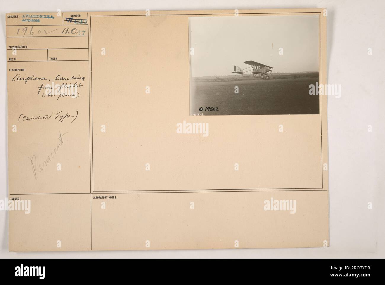 An American biplane of the Candion Type makes a landing after a flight ...