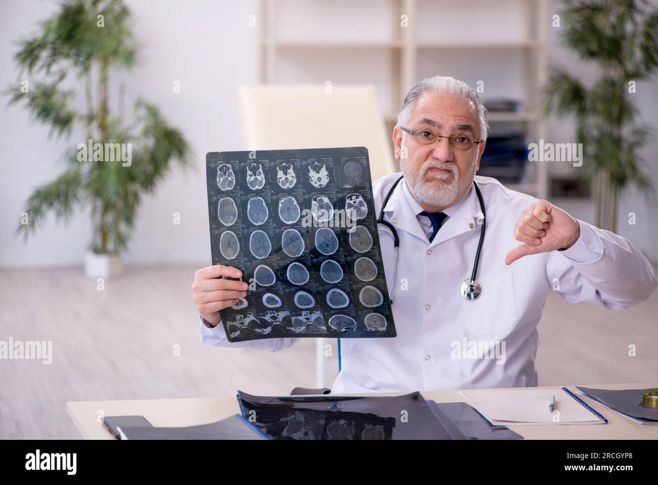 Old doctor radiologist working at the hospital Stock Photo - Alamy