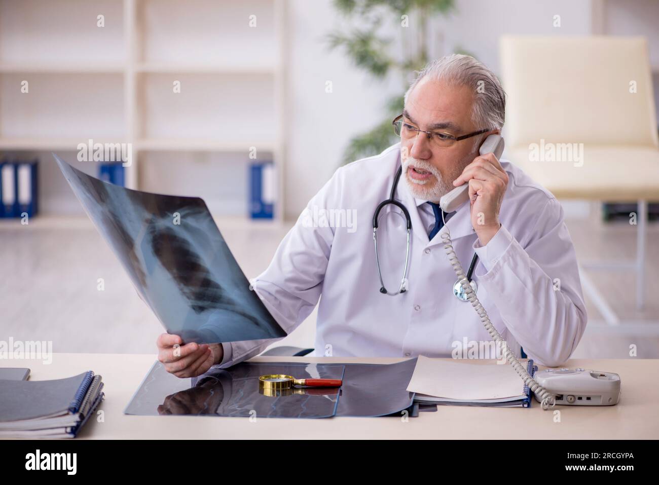 Old doctor radiologist working at the hospital Stock Photo - Alamy