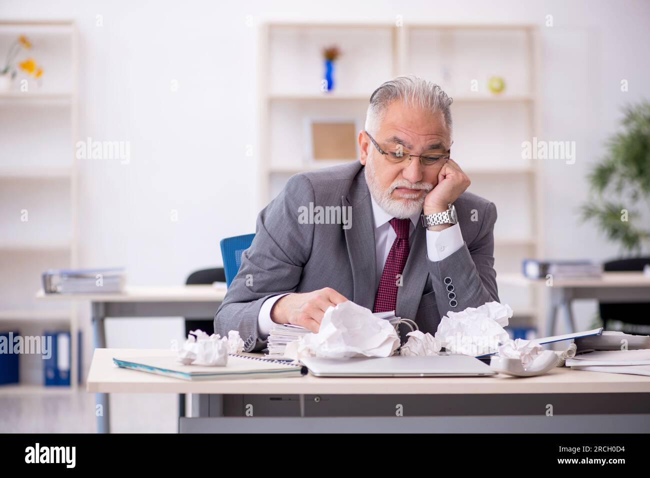 Old employee working in the office Stock Photo - Alamy
