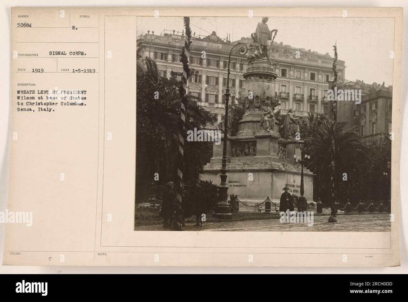 President Wilson lays a wreath at the base of the Christopher Columbus ...