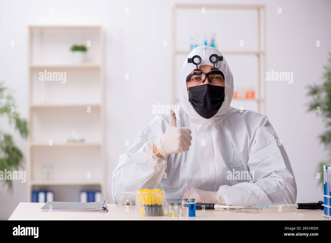 Young chemist working at the lab during pandemic Stock Photo - Alamy