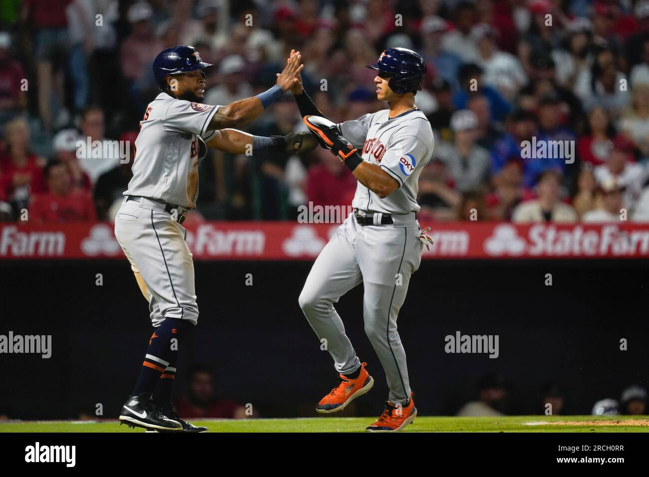 Houston Astros' Corey Julks, left, and Jeremy Pena, right, celebrate ...