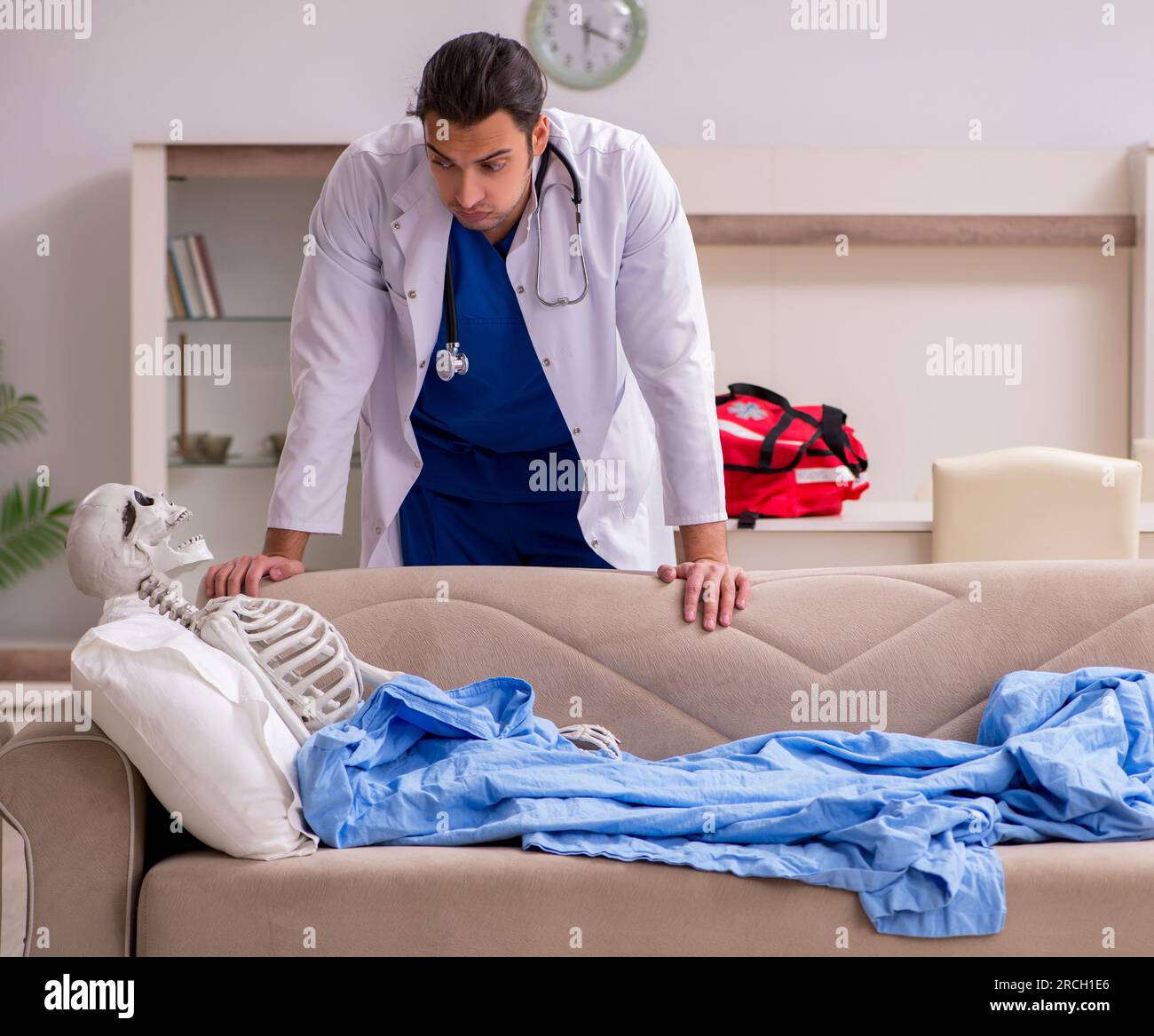 Male paramedic visiting skeleton patient Stock Photo - Alamy