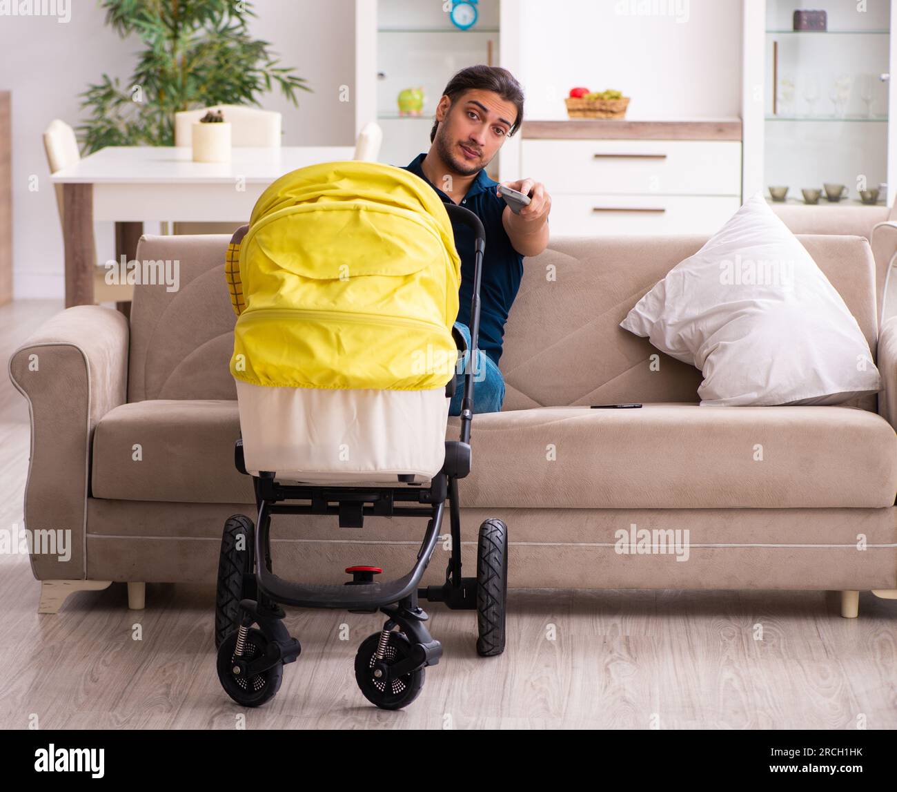 Young father looking after newborn baby Stock Photo - Alamy