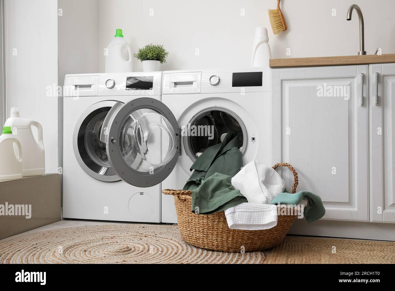 Modern washing machines with dirty clothes in laundry room Stock Photo ...