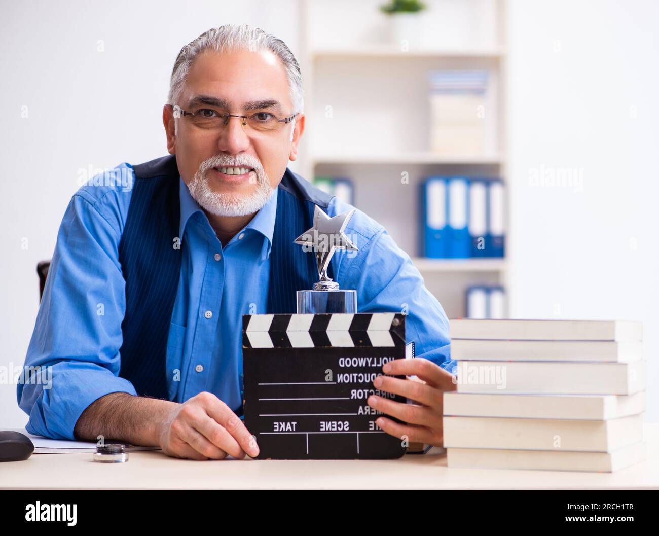 Old male author writing the screenplay Stock Photo - Alamy