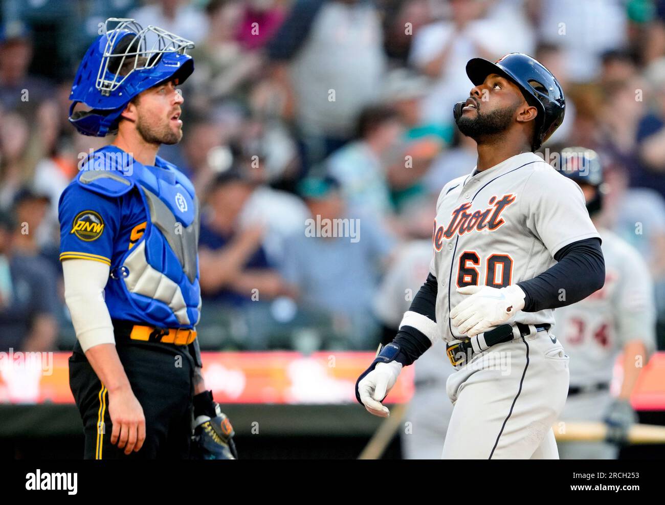 Detroit Tigers' Akil Baddoo (60) crosses home plate after hitting a solo home run, next to ...