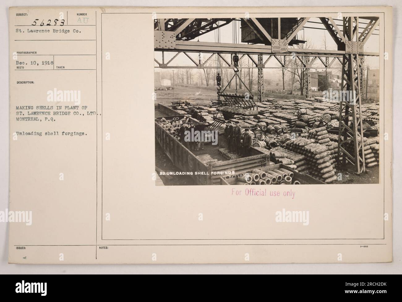 Workers unloading shell forgings at the St. Lawrence Bridge Co., LTD ...