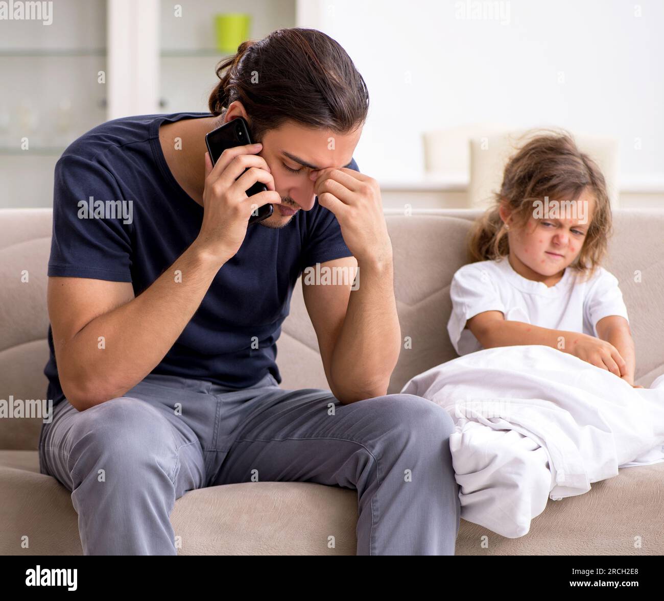The father taking care of his ill daughter Stock Photo - Alamy