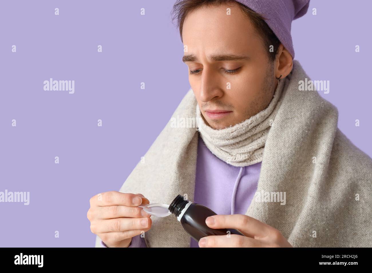 Man taking cough syrup hi-res stock photography and images - Alamy