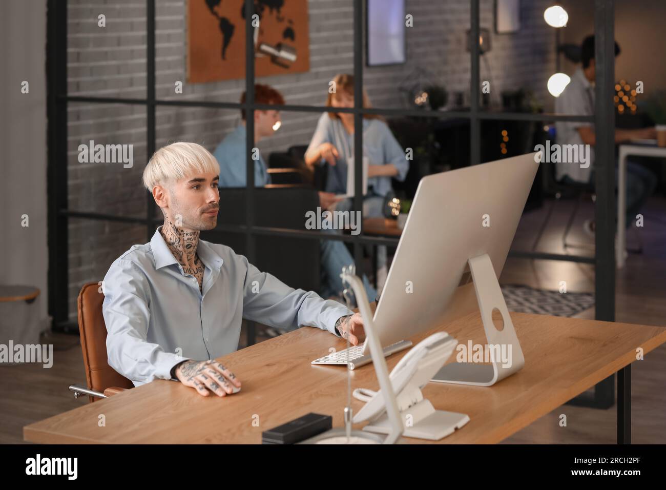 Male programmer working with computer in office at night Stock Photo ...