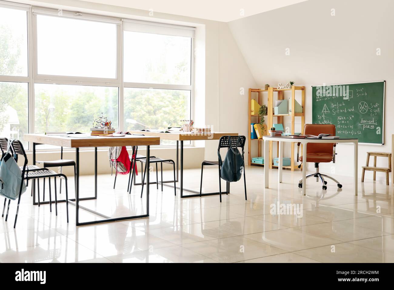 Interior of classroom with desks Stock Photo - Alamy