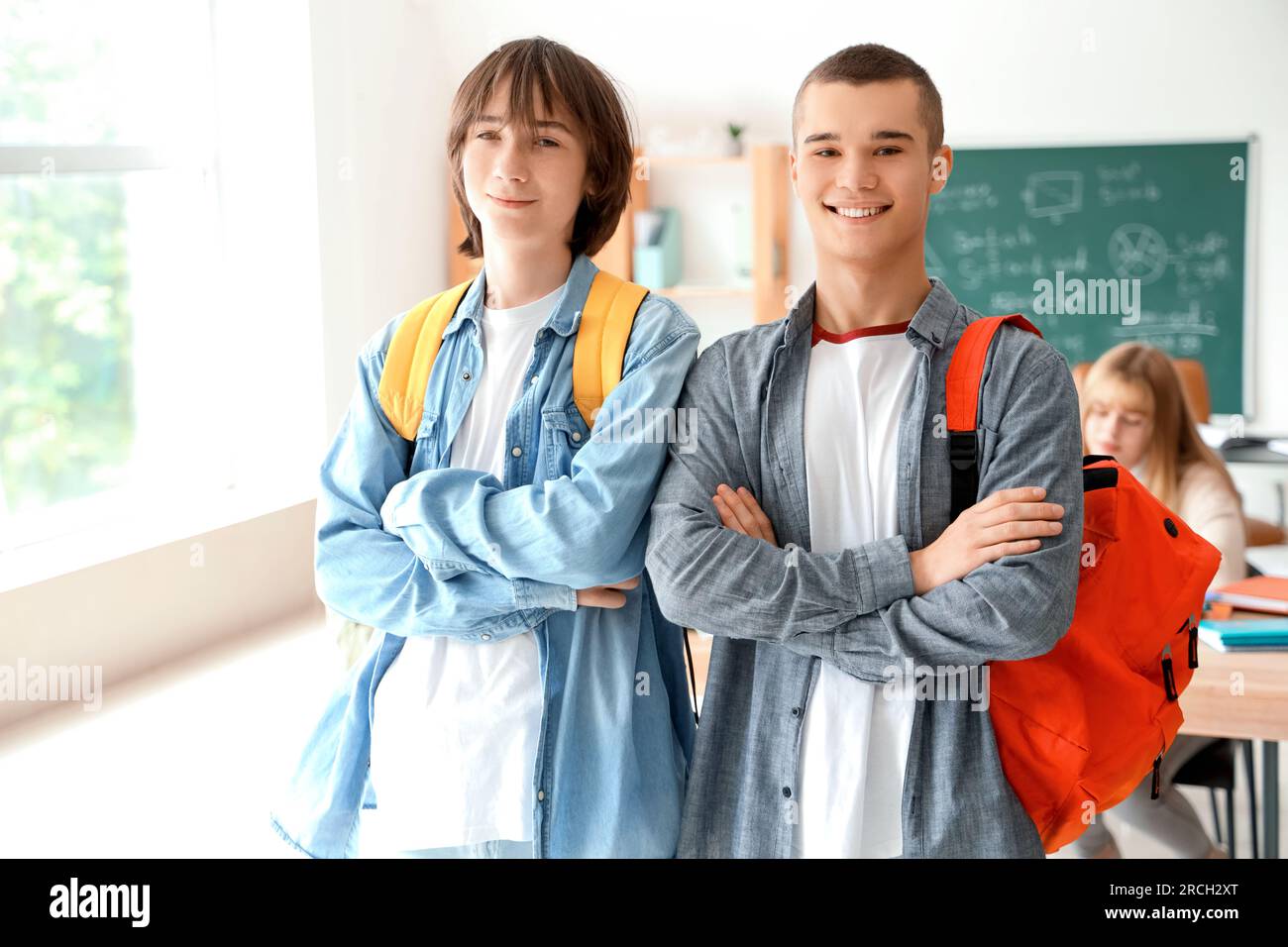 Backpacks in classroom hi-res stock photography and images - Alamy