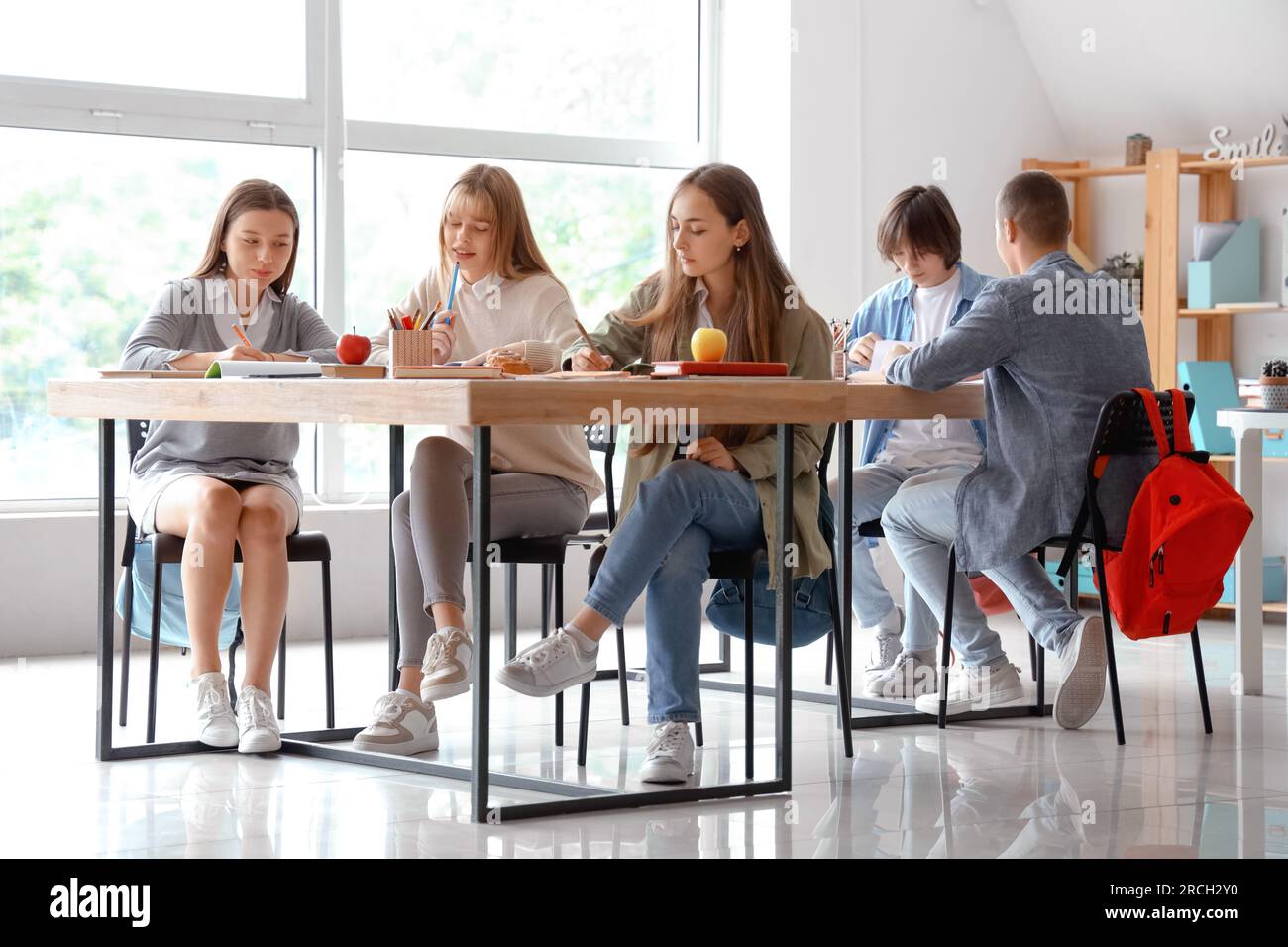 Teenage students studying in classroom hi-res stock photography and ...
