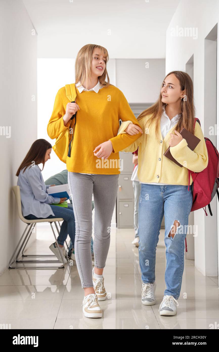 Teenage girls walking at school Stock Photo - Alamy