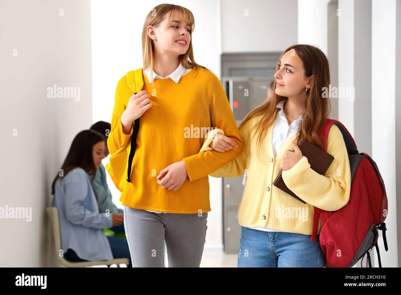 Teenage girls walking at school Stock Photo - Alamy