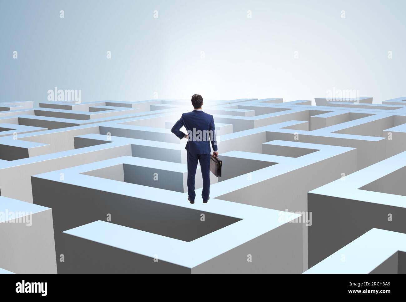 The businessman trying to escape from maze Stock Photo - Alamy