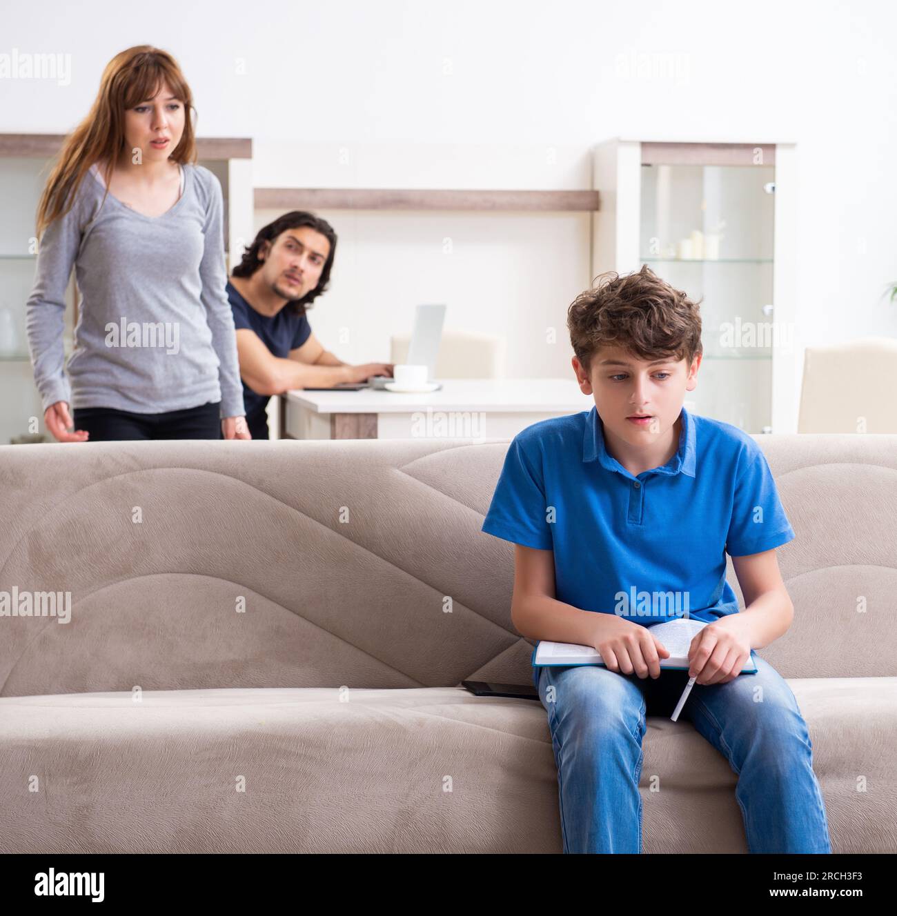 The concept of underage smoking with young boy and family Stock Photo ...