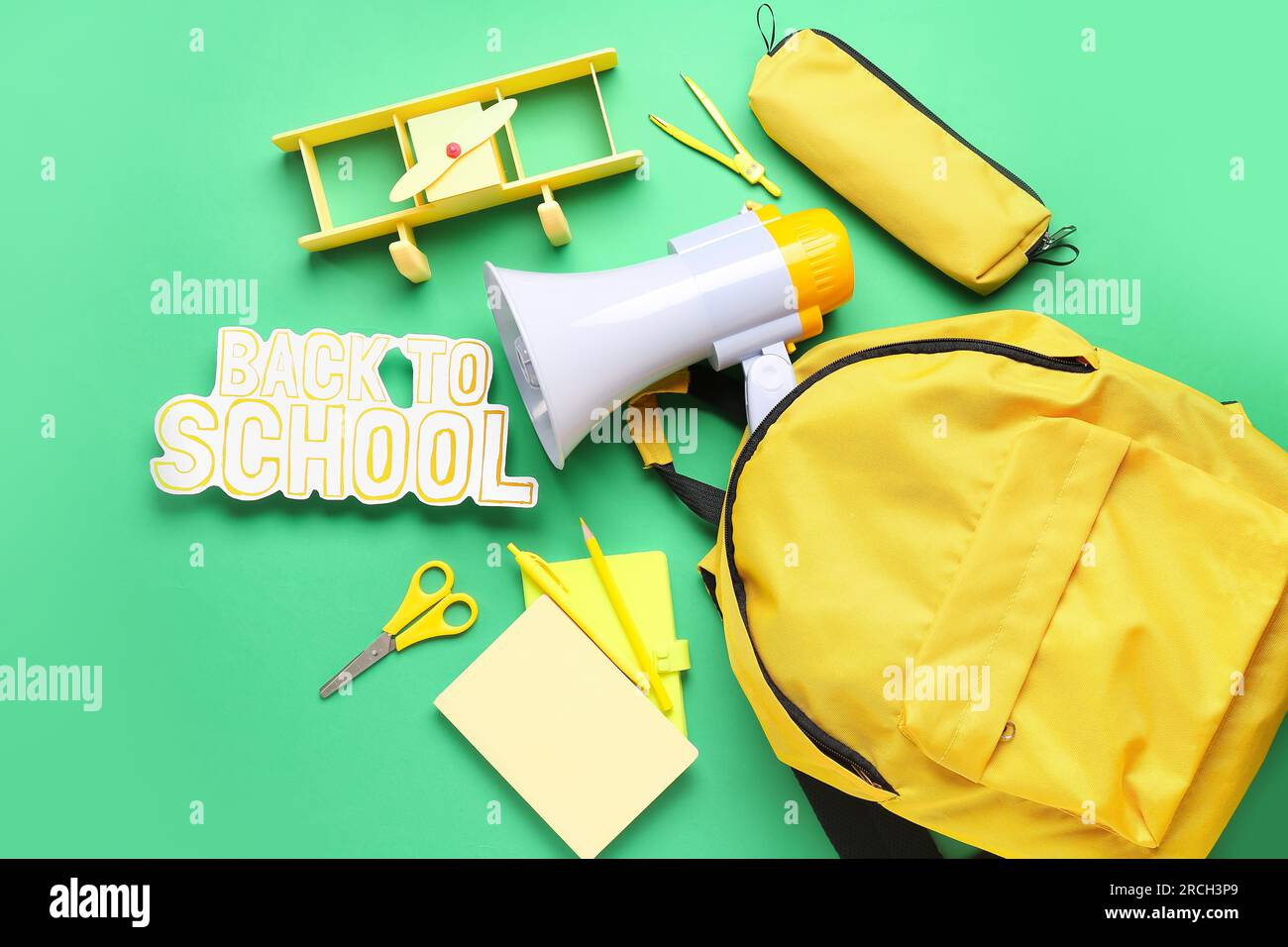 Backpack, stationery and megaphone with paper text BACK TO SCHOOL on ...