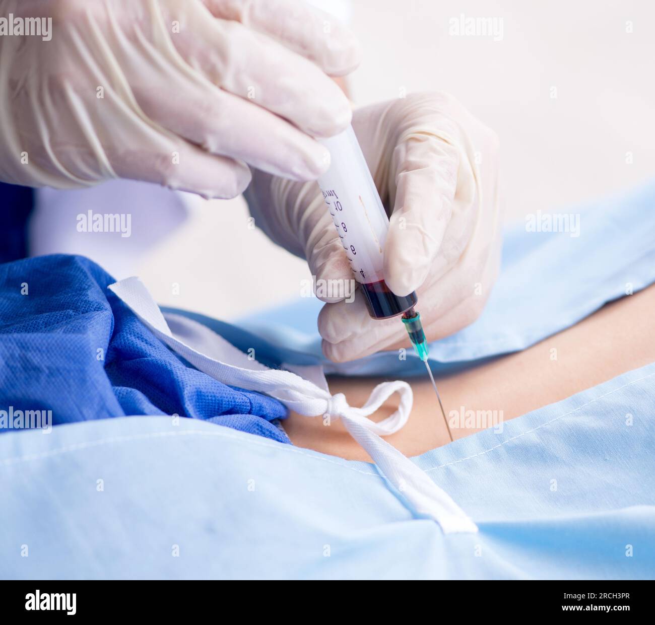The female patient getting an injection in the clinic Stock Photo - Alamy