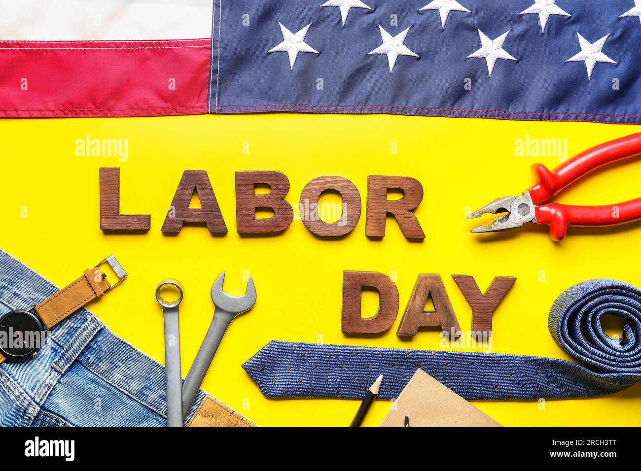 Composition with different tools, jeans, tie, text LABOR DAY and USA ...