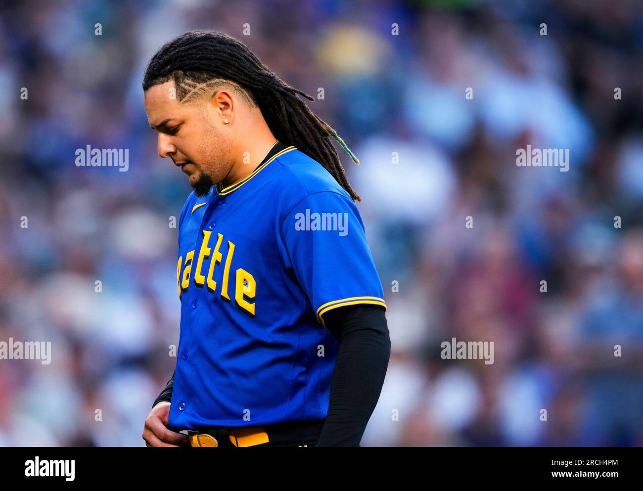 Seattle Mariners starting pitcher Luis Castillo walks off the field ...