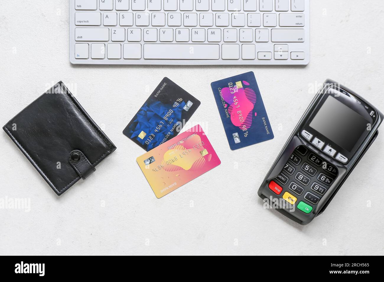 Keyboard with leather wallet, payment terminal and credit cards on ...