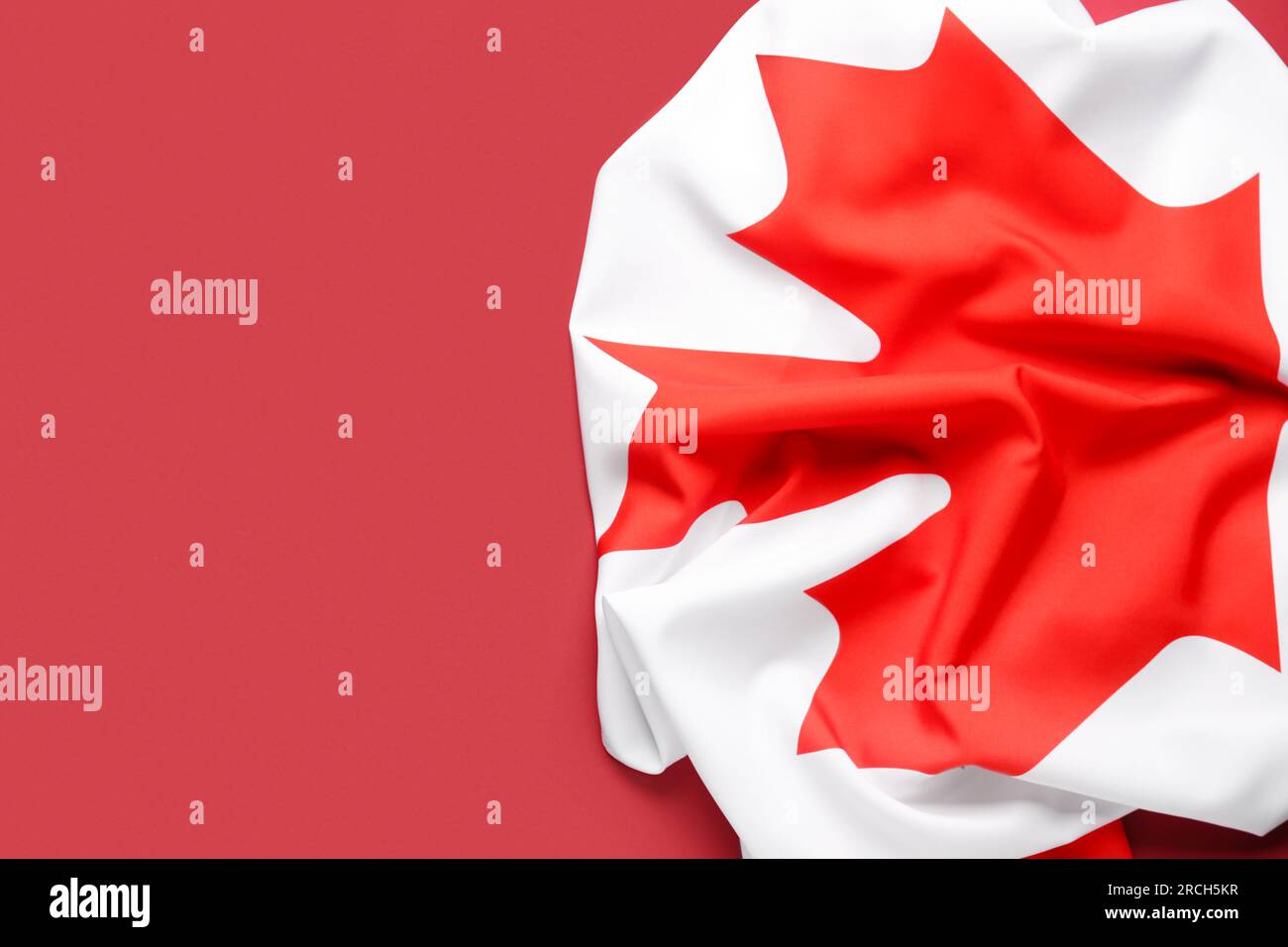 Flag of Canada on red background Stock Photo - Alamy